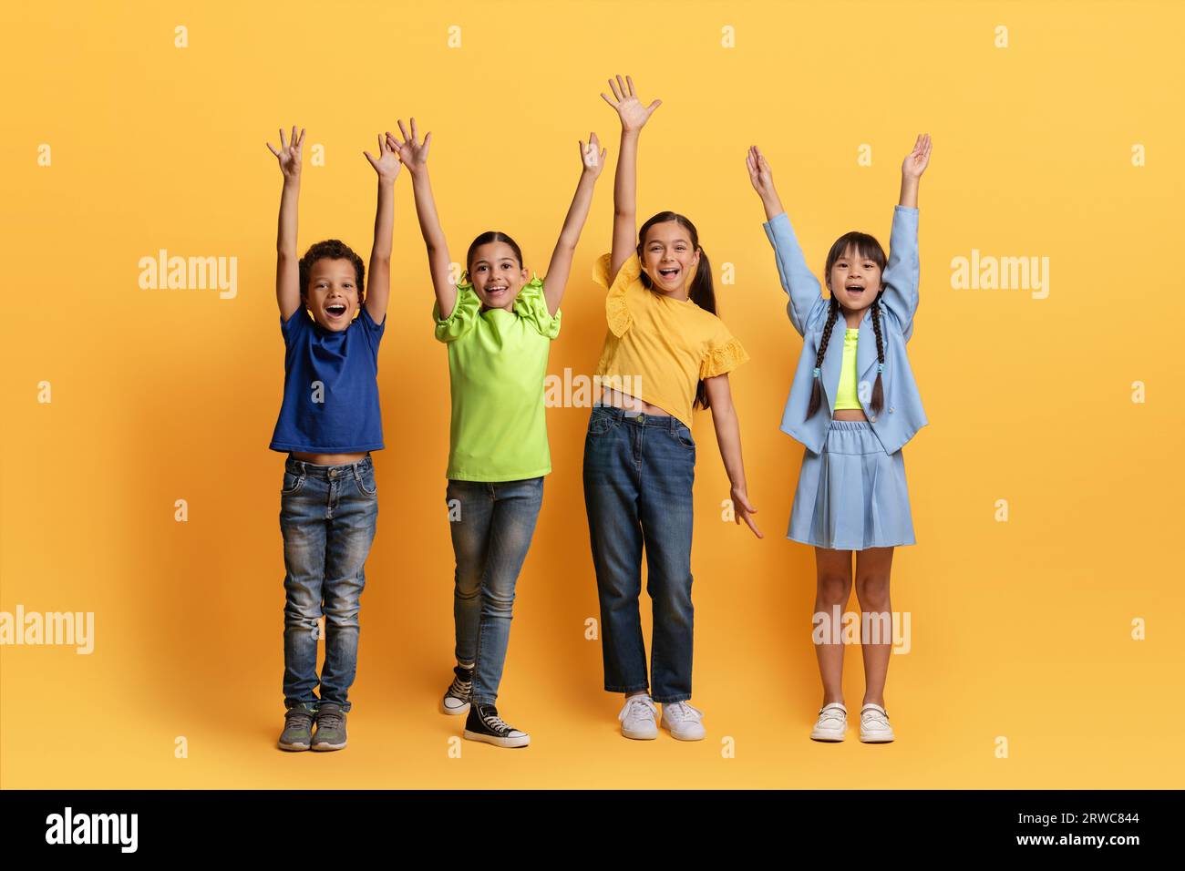 Emotional kids with their hands up hi-res stock photography and images ...