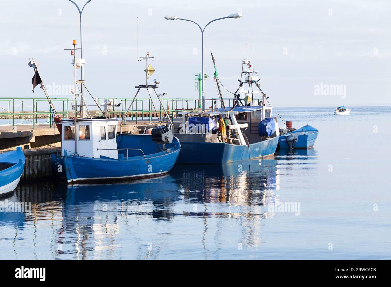 Fishing boats on the port quay, Baltic sea Stock Photo - Alamy