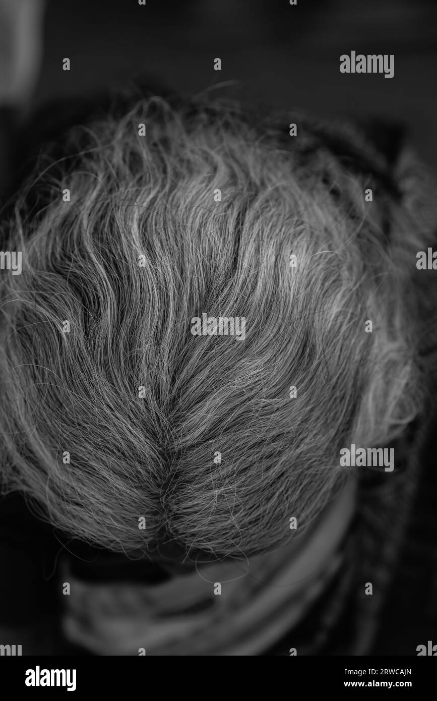 The gray covers the entire head of an elderly woman. The shot was taken ...