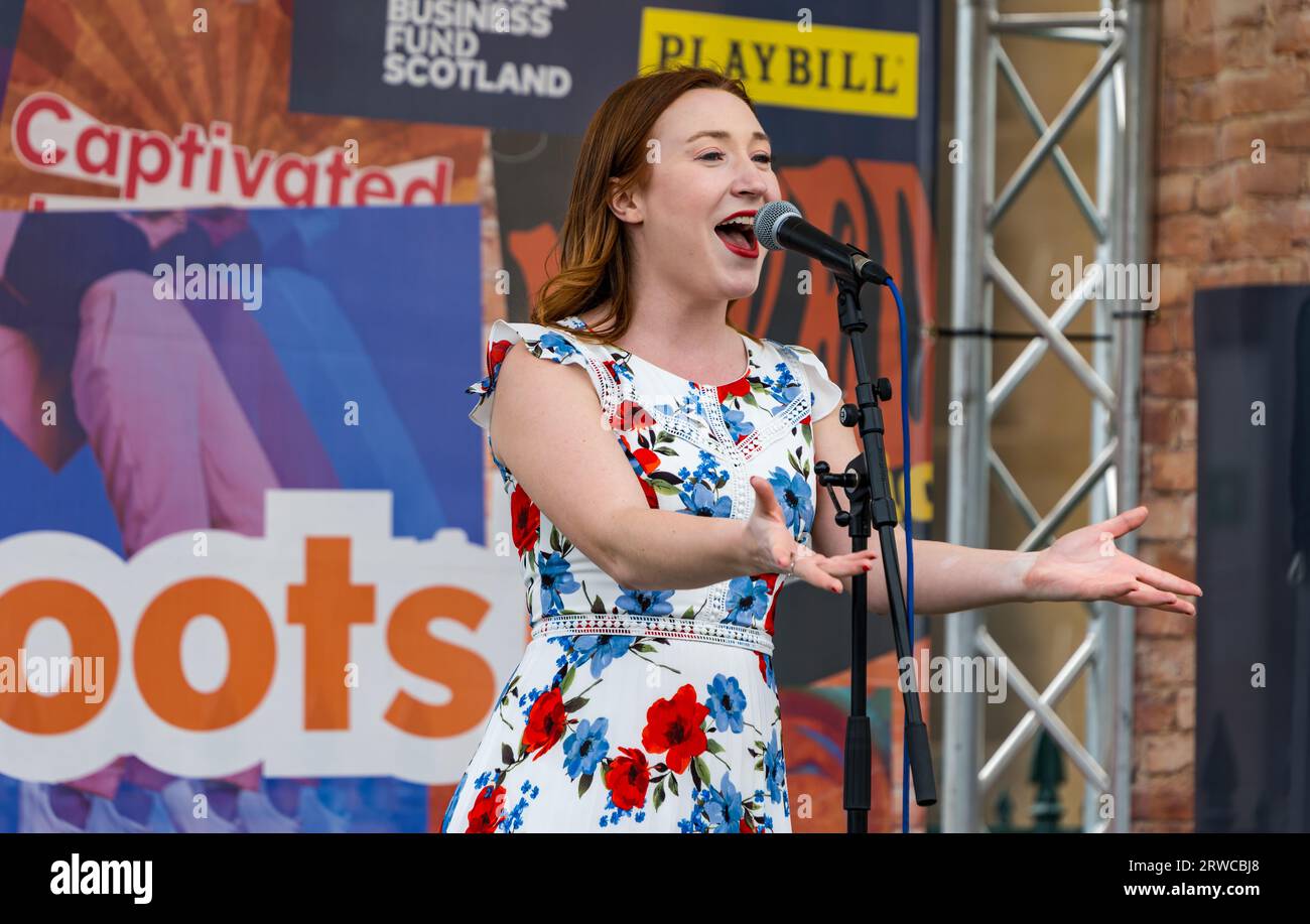 Performer singing on temporary stage during Edinburgh Festival Fringe ...