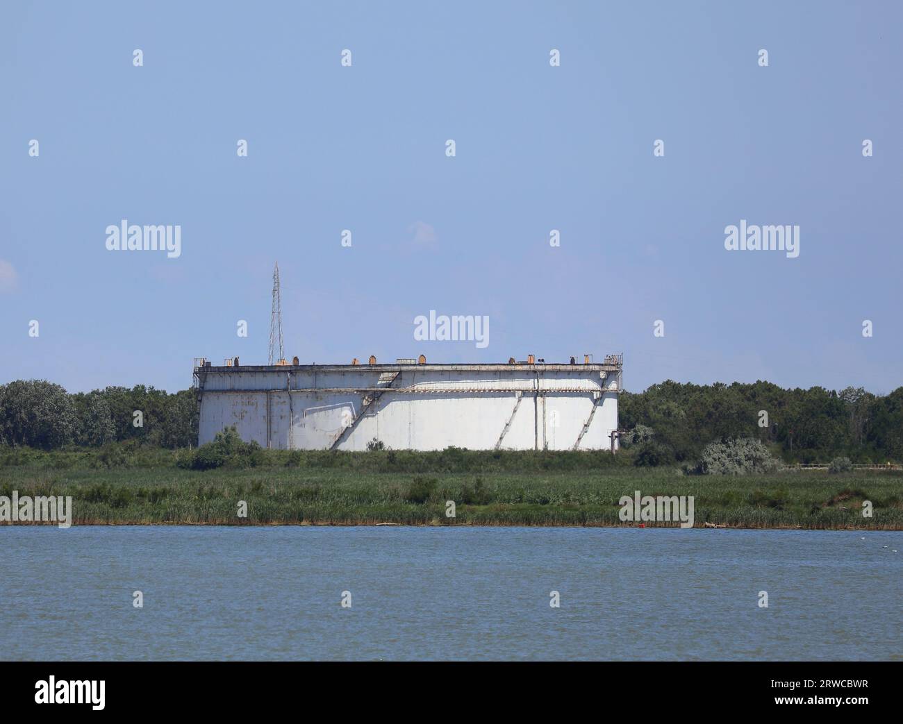 methane gas storage called gasometer on the river bank for the storage ...