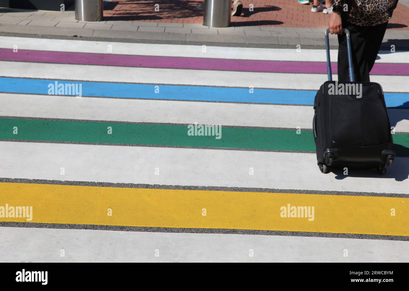 multicolored stripes with the rainbow colors of crossing people and ...