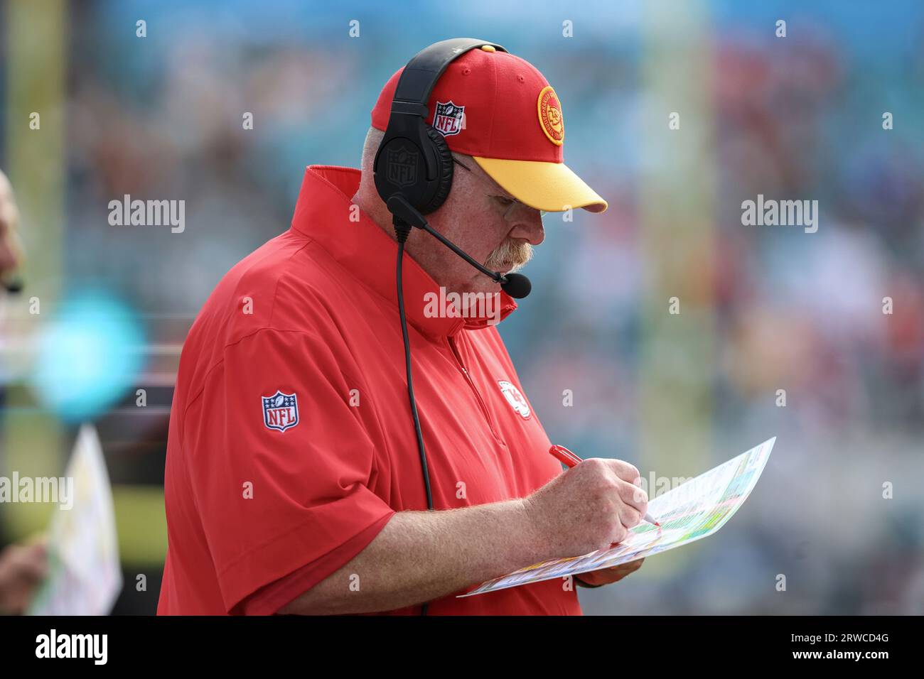 Kansas City Chiefs head coach Andy Reid jots a note during the second ...