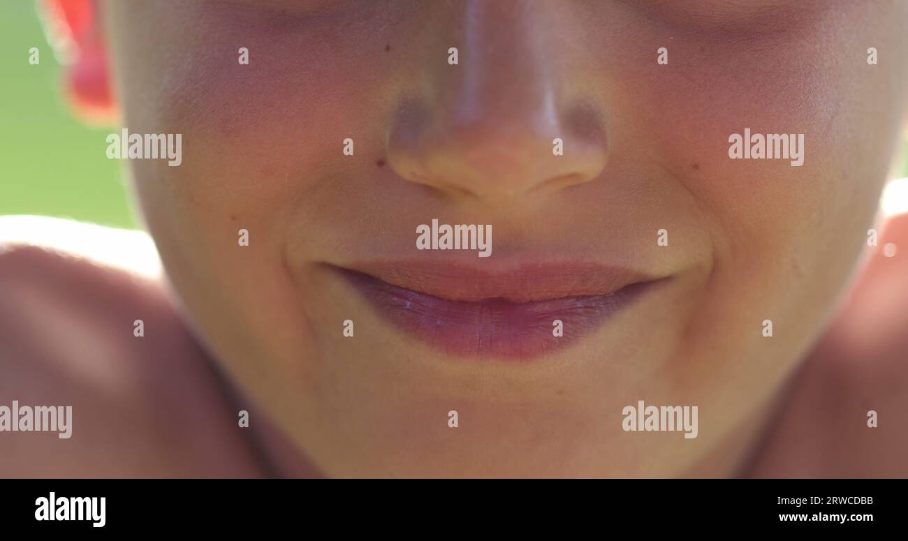 Upset child boy changing emotion becoming serious. Macro close-up kid ...