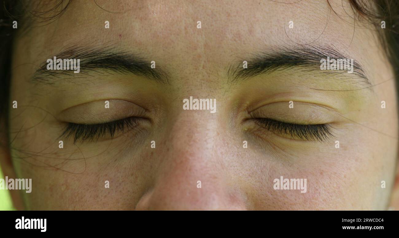 Woman opening eyes in meditation and contemplation Stock Photo - Alamy