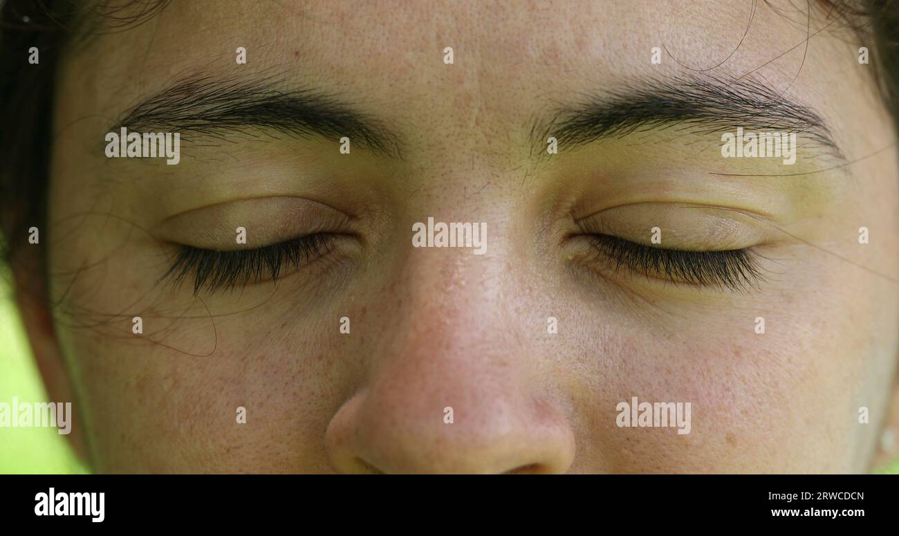 Woman opening eyes in meditation and contemplation Stock Photo - Alamy