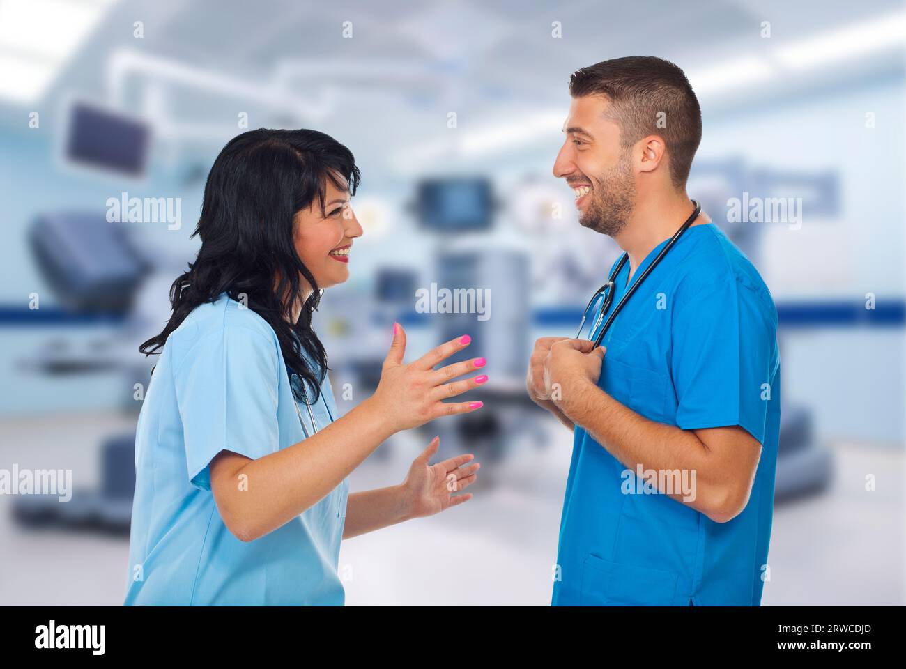 Two doctors having a funny conversation and they both laughing while ...