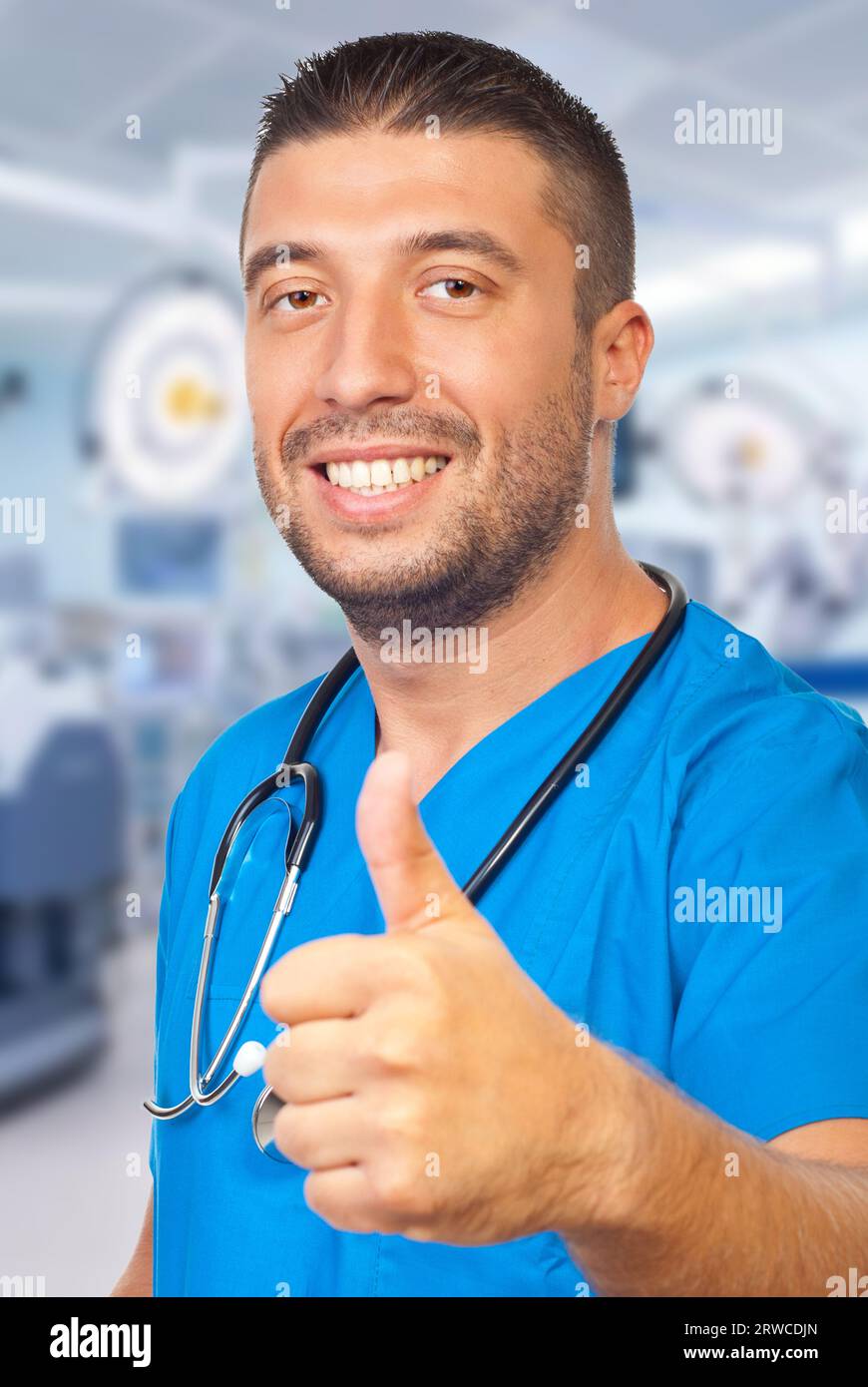 Handsome doctor giving thumb up hi-res stock photography and images - Alamy