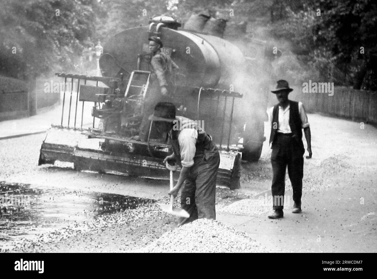 Tar spreading, England, possibly 1930s Stock Photo - Alamy