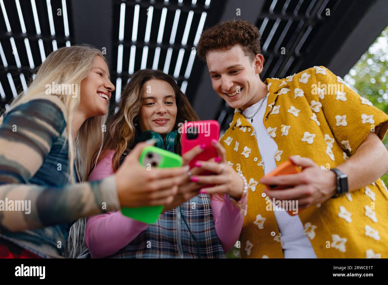 Generation z students hanging out together outdoors in the city Stock ...