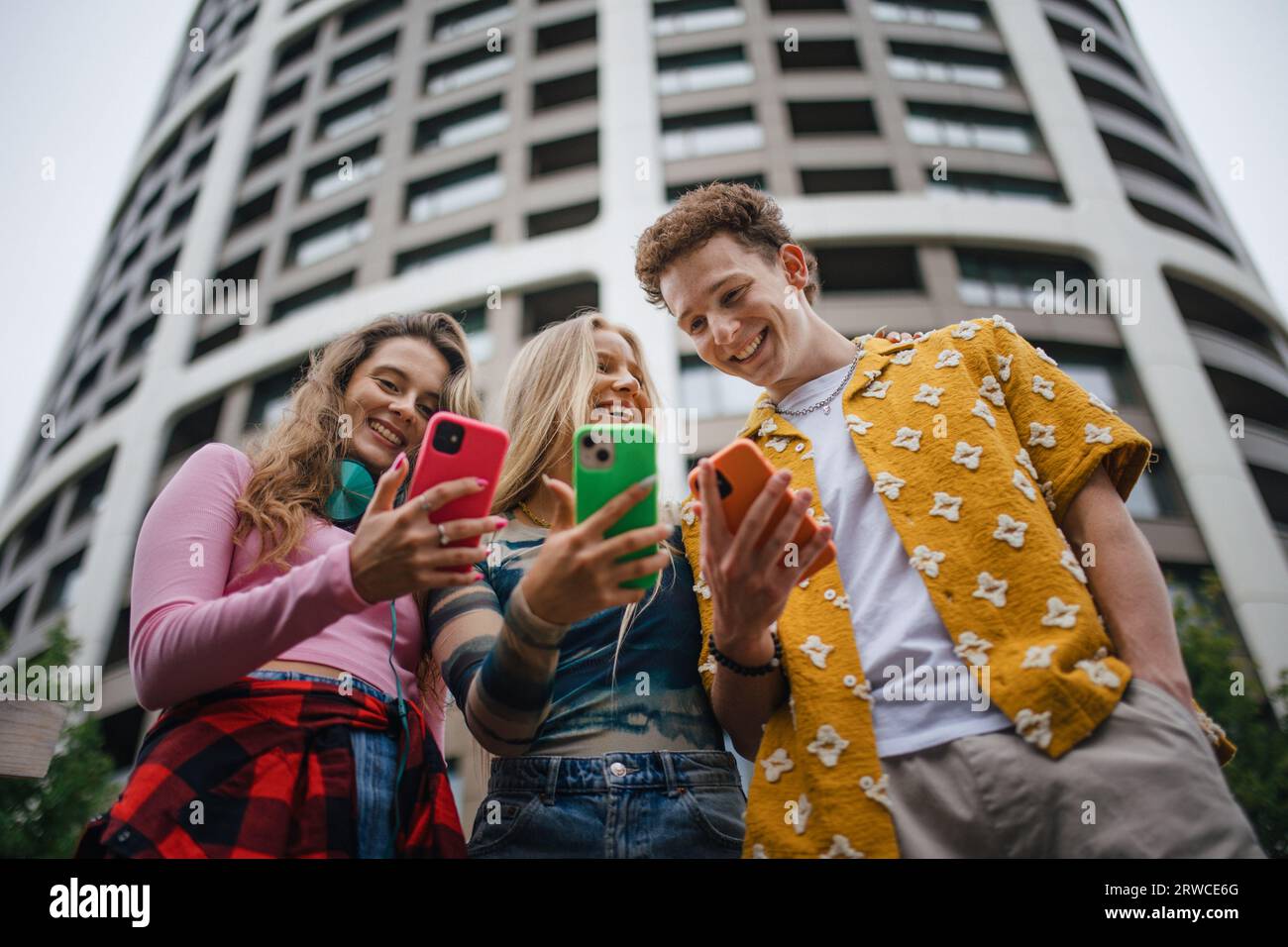 Generation z students hanging out together outdoors in the city Stock ...