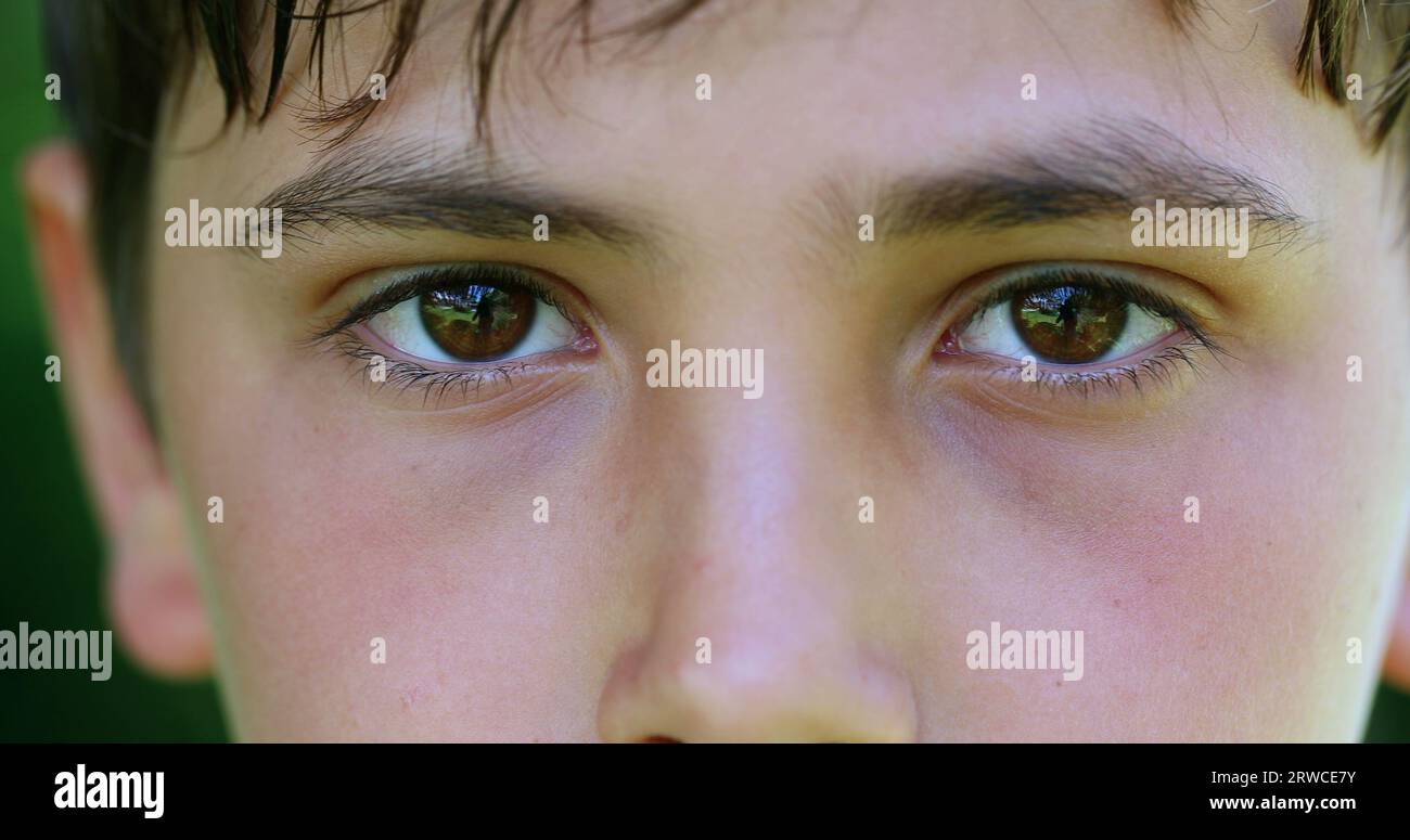 Serious child boy face eyes macro closeup looking to camera Stock Photo ...