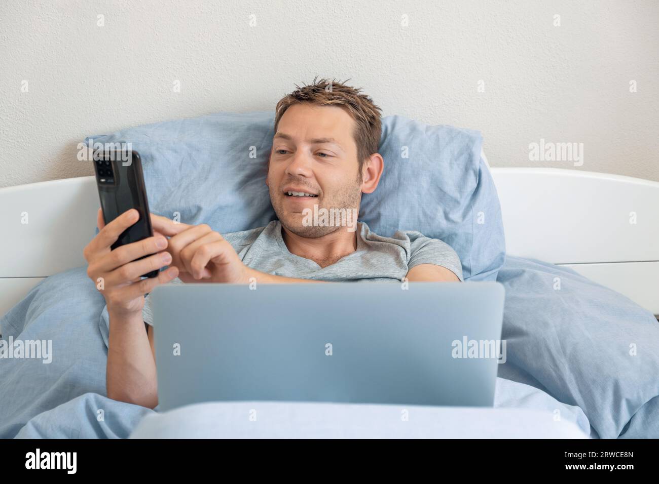 Businessman laying on bed hi-res stock photography and images - Alamy