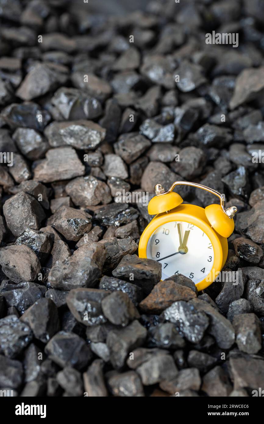 clock with an alarm for the twelve o clock furnace lying in a coal heap ...