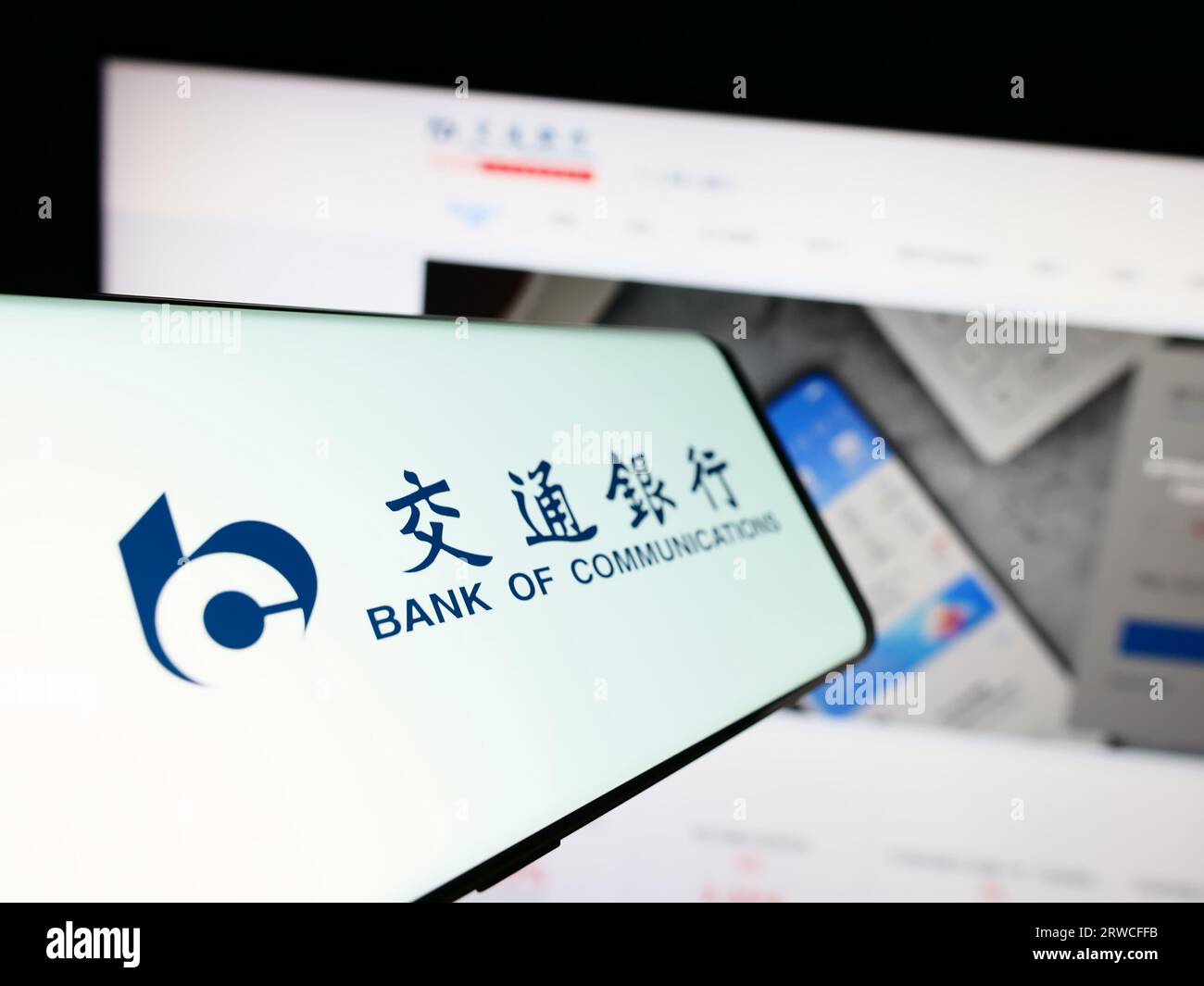 Mobile phone with logo of Chinese company Bank of Communications ...