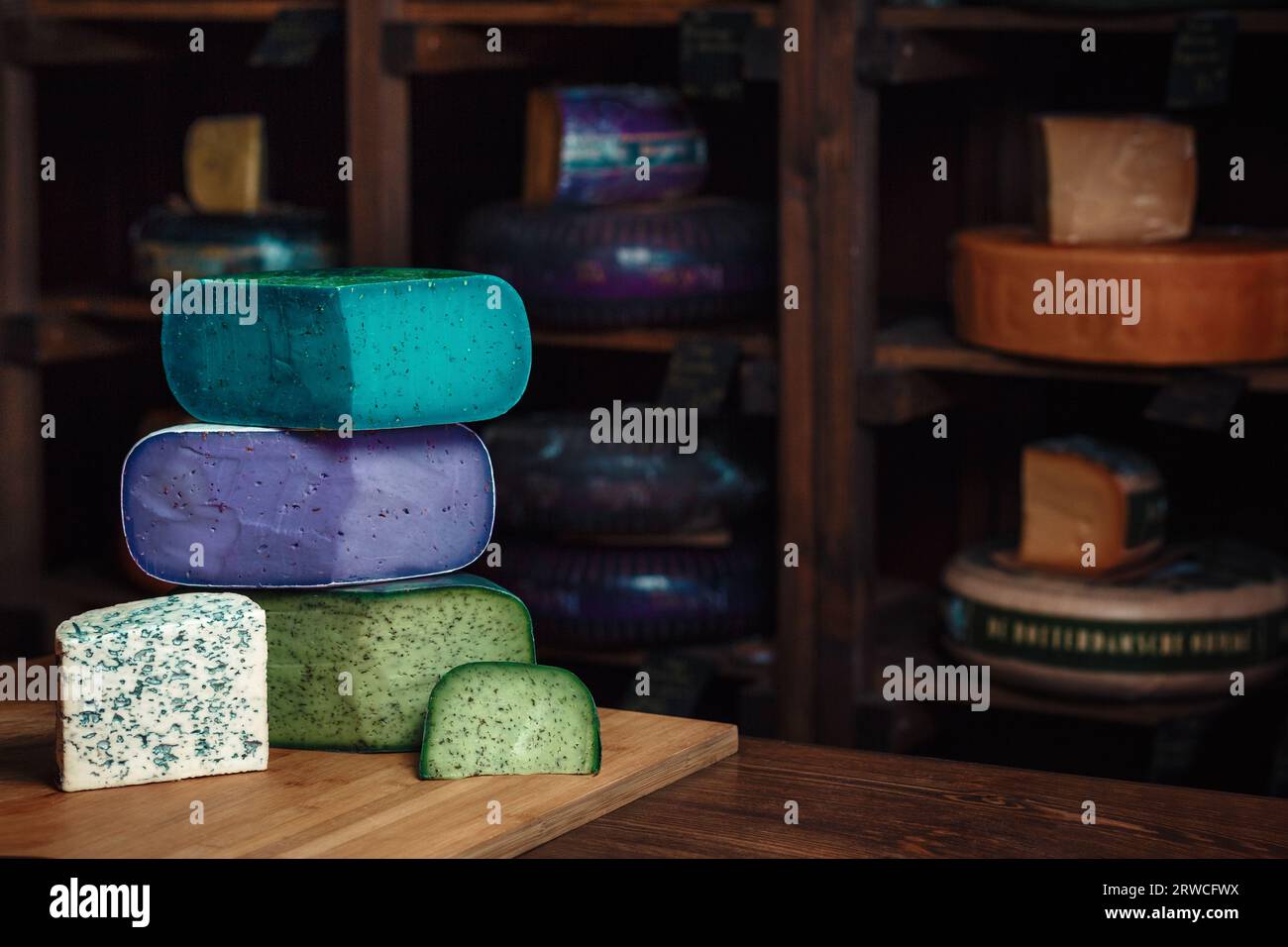 cheeses of different colors, head, pyramid of cheese, an abundance of ...