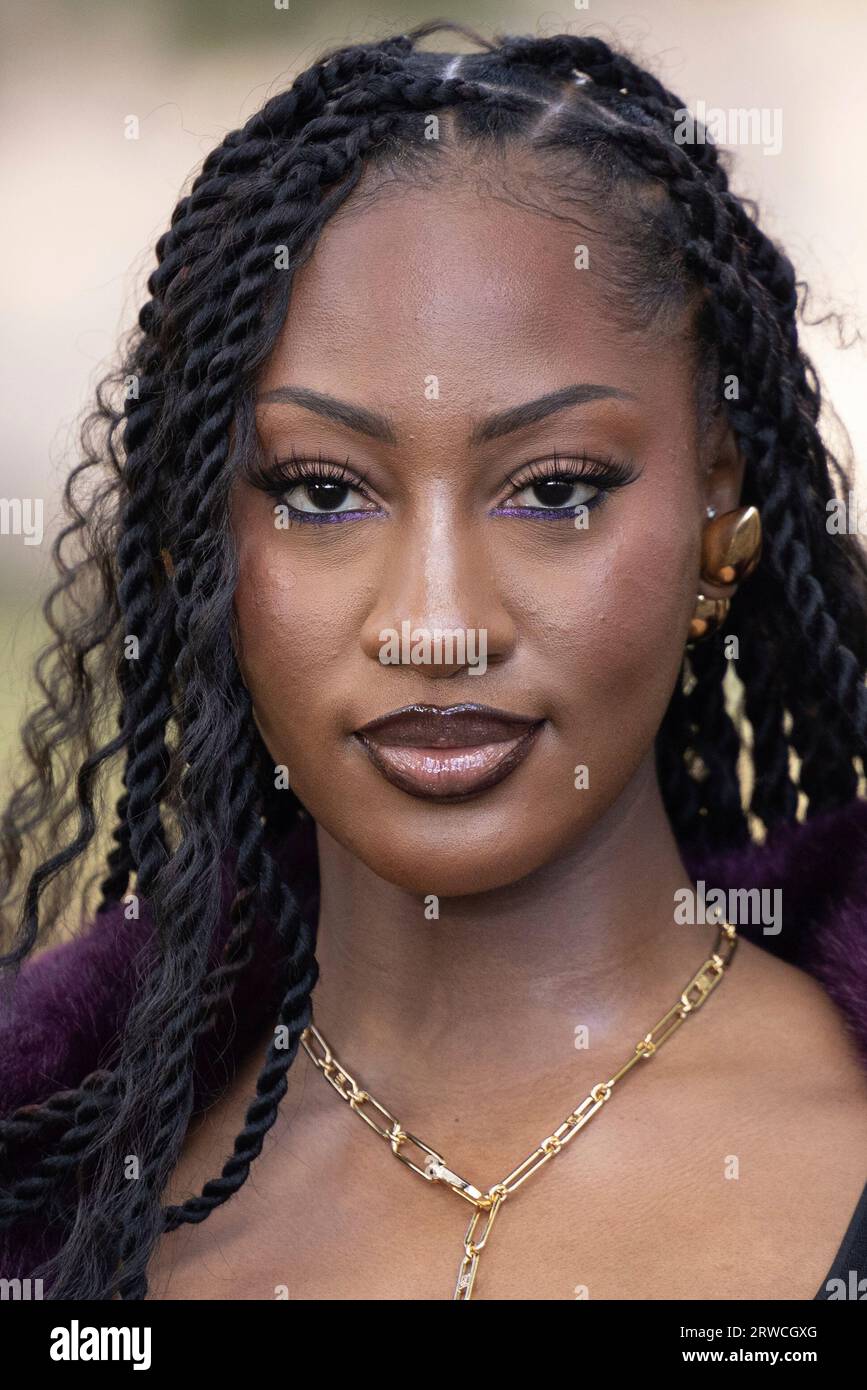 Tems poses for photographers upon arrival at the Burberry Spring Summer ...