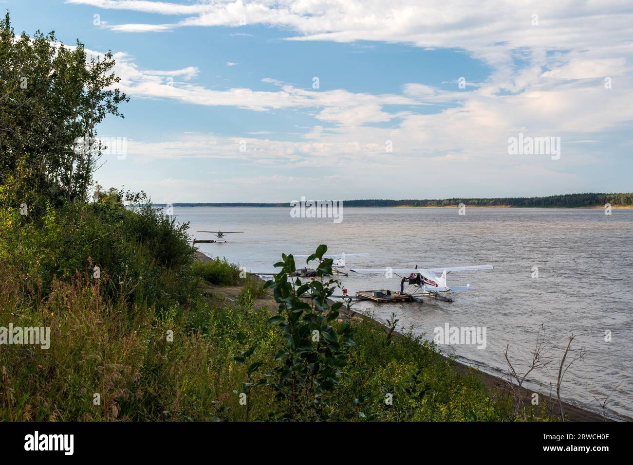 Float Planes Sit on the Beautiful Mackenzie River Near Fort Simpson ...