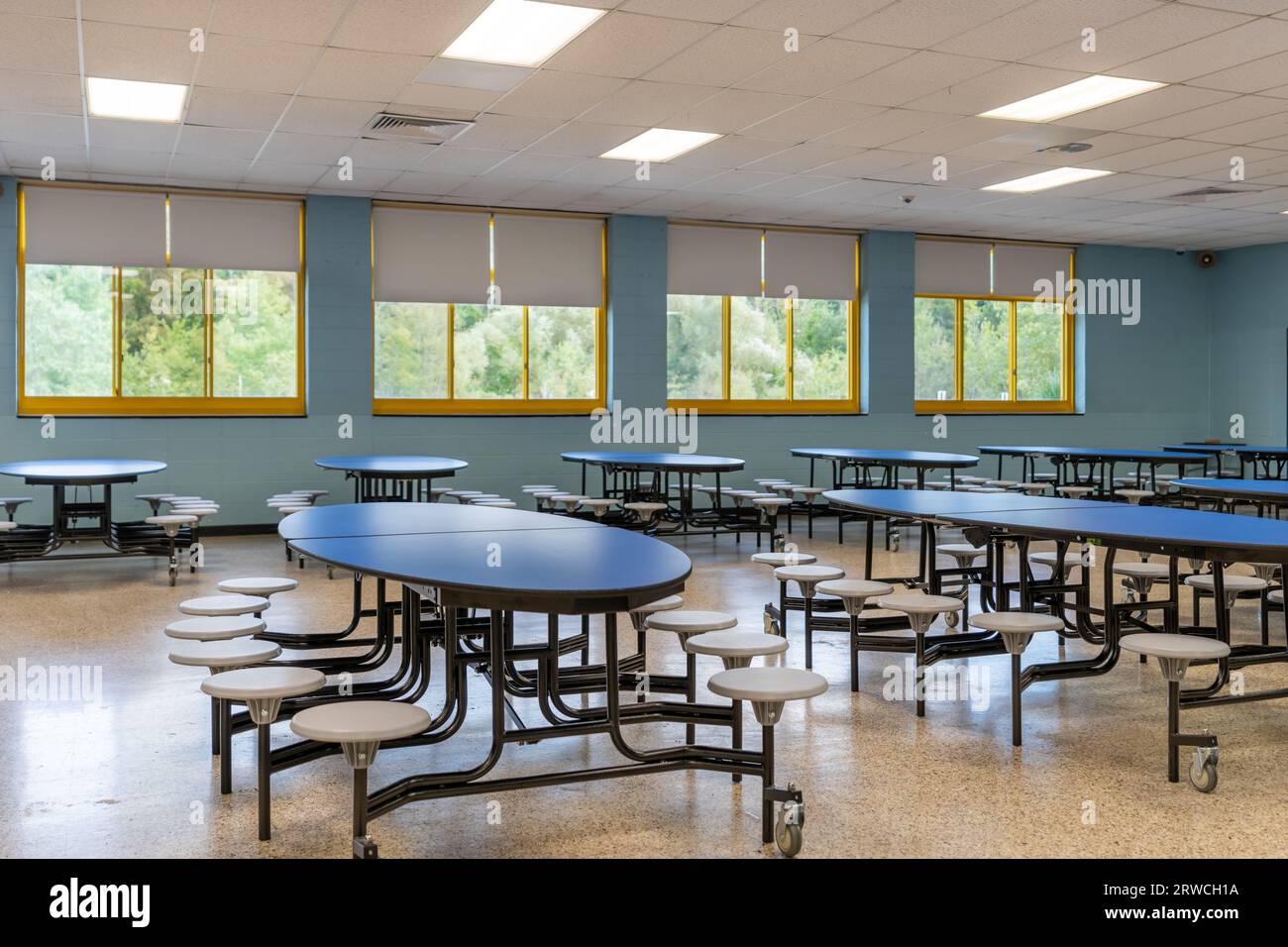 Blue folding table with attached seats in a school cafeteria Stock ...