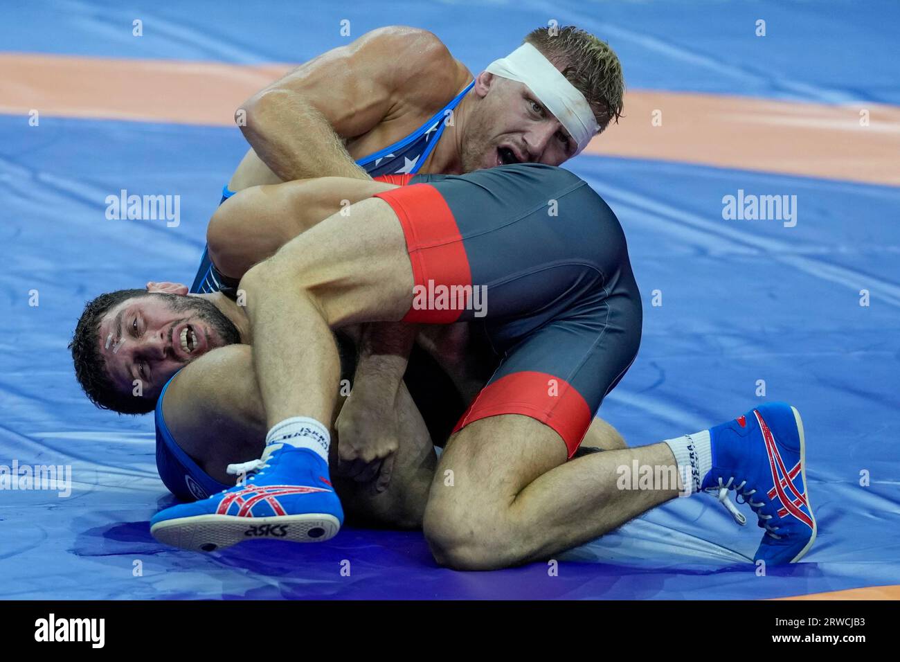 Zaurbek Sidakov of Russia, front, and Kyle Douglas Dake of US compete ...
