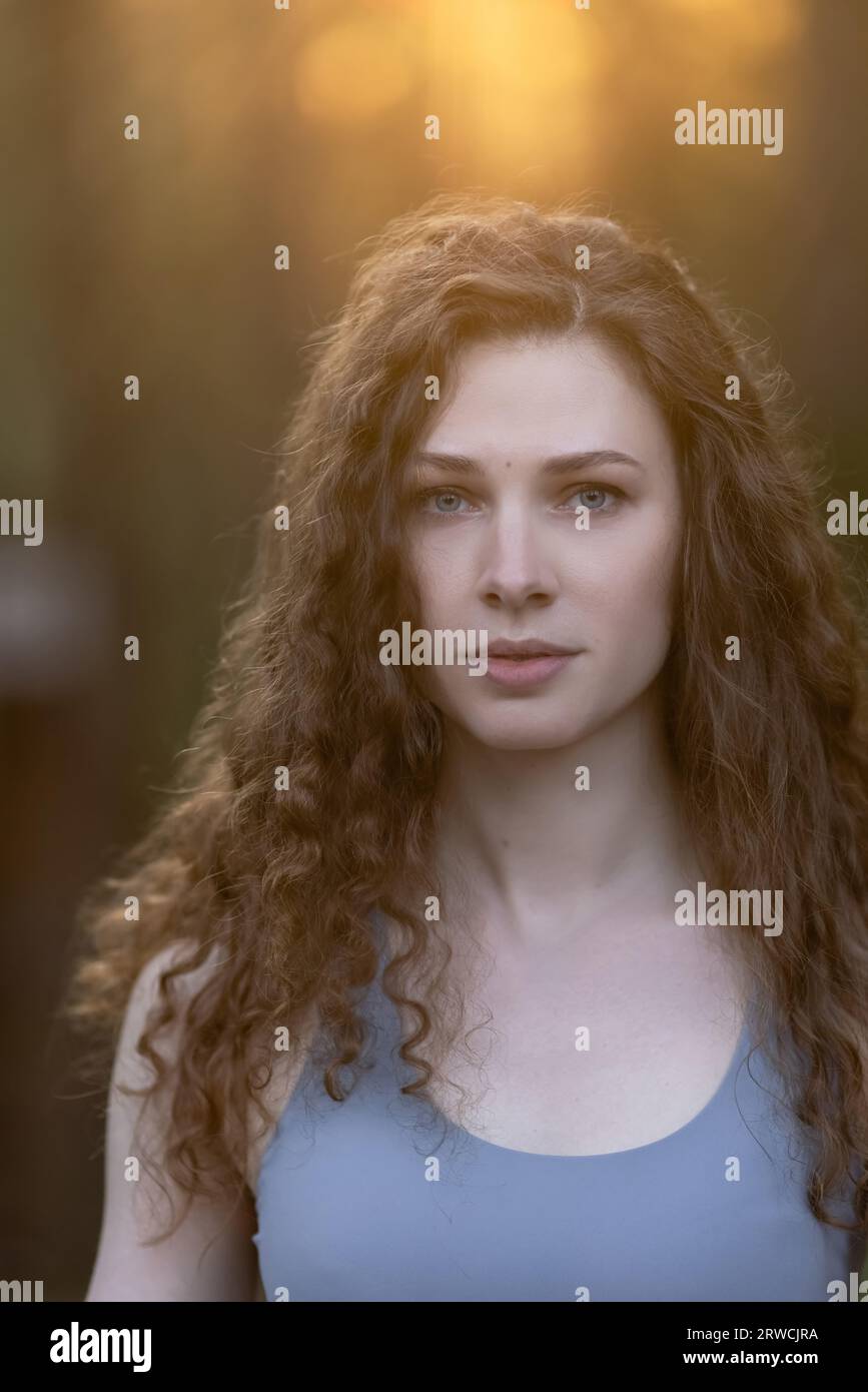 Young, beautiful skinny brunette posing in a forest grove. Young ...