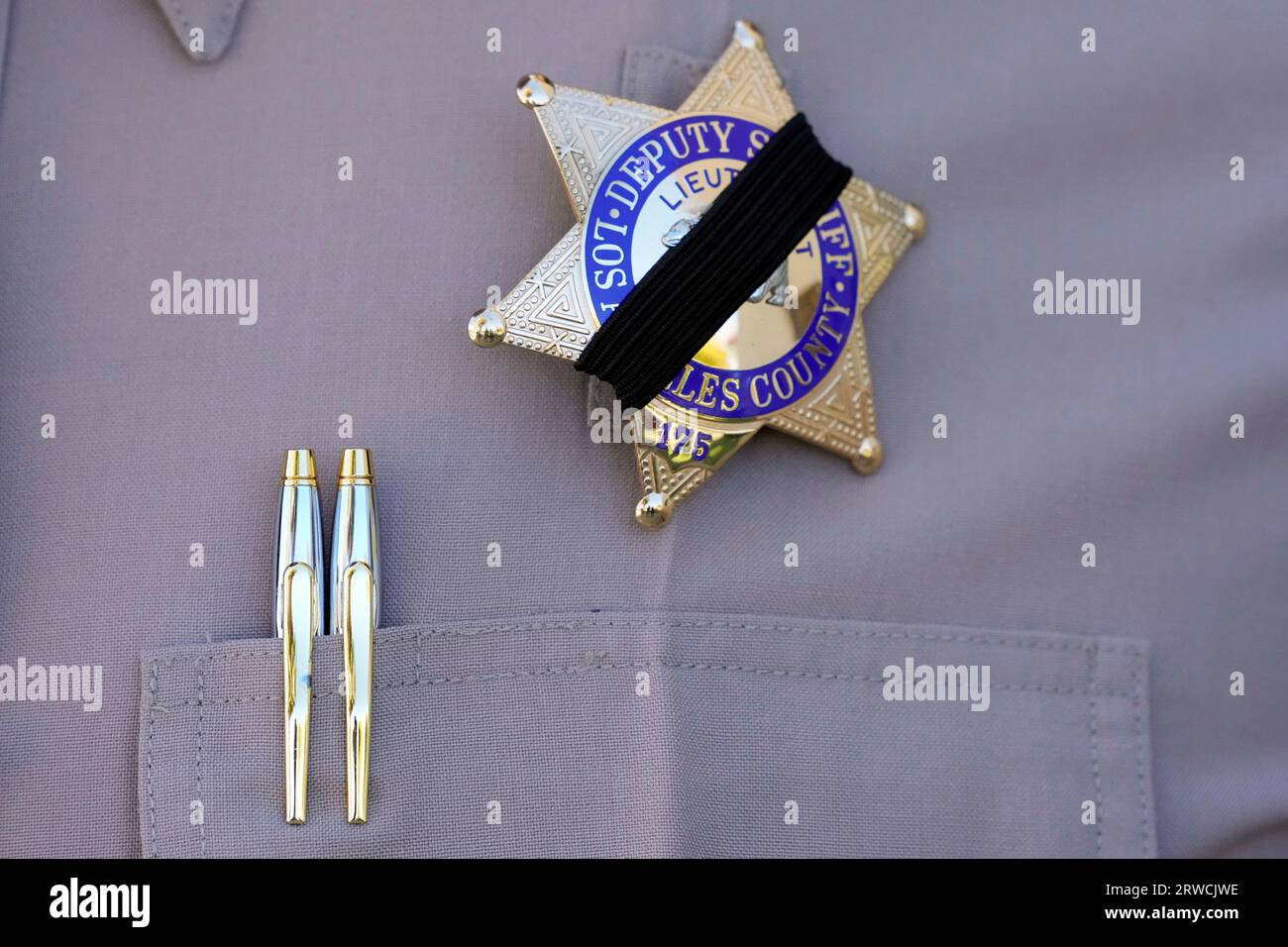 A member of the Los Angeles County Sheriff's department wears a black ...