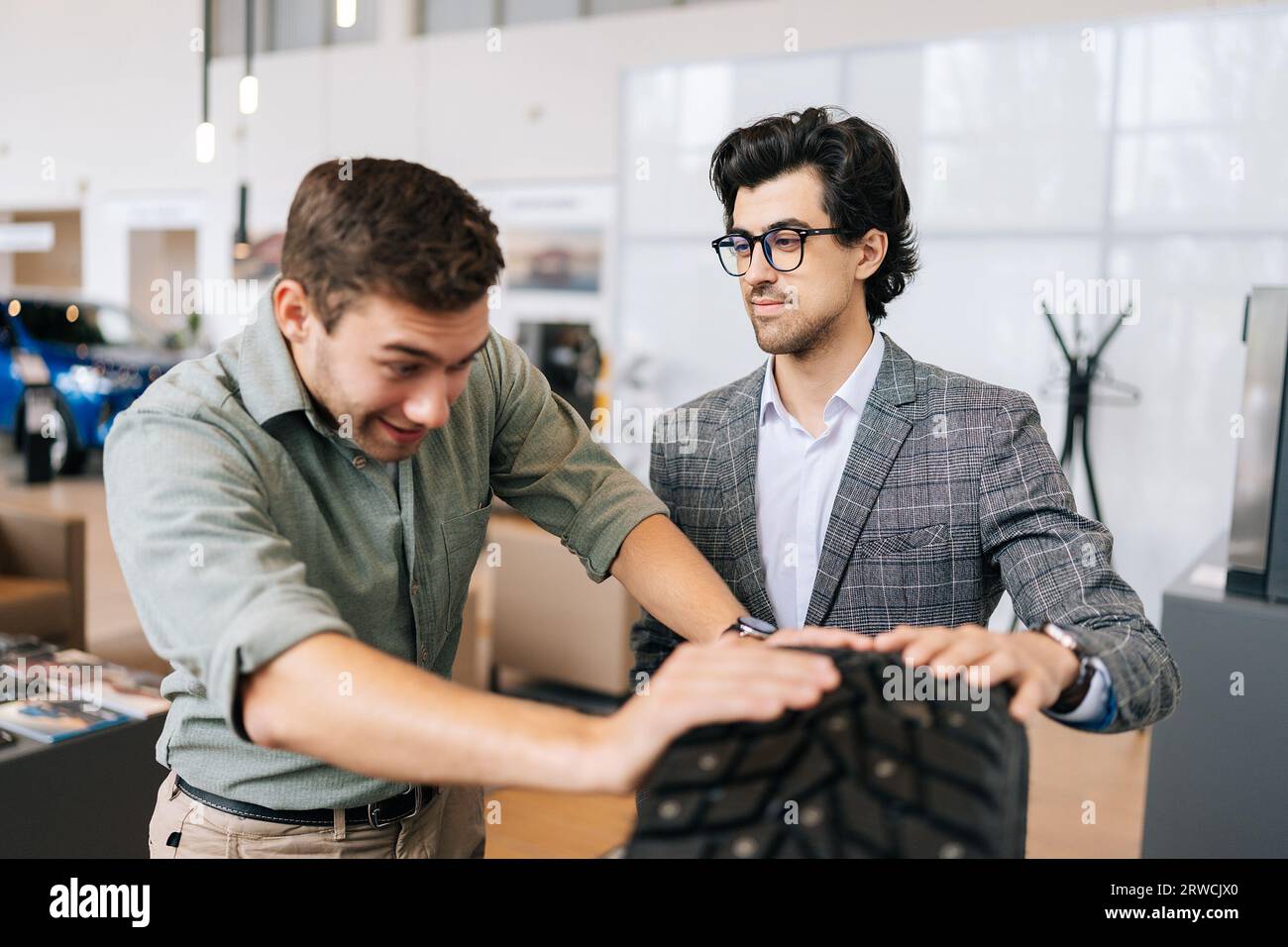 Confident salesman in business suit talking about characteristic of ...