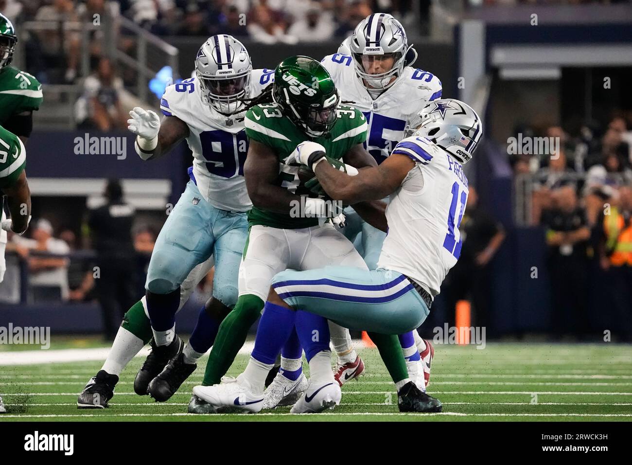New York Jets running back Dalvin Cook (33) is tackled by Dallas ...
