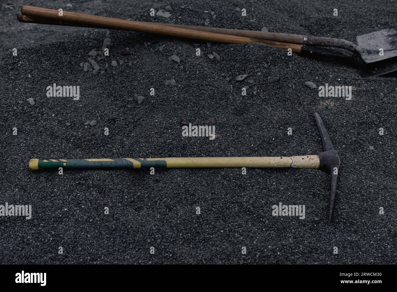 Pickaxe in the mine An old weathered spade with a rusty blade Coal ...