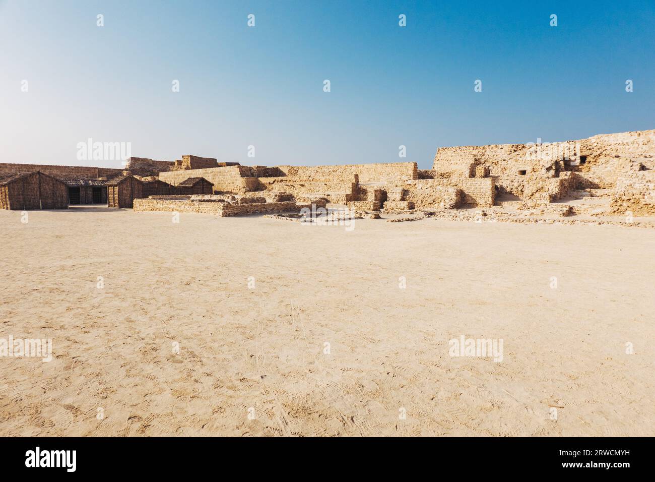 ancient stone walls of Qal'at al-Bahrain, a Bahraini fort dating back ...