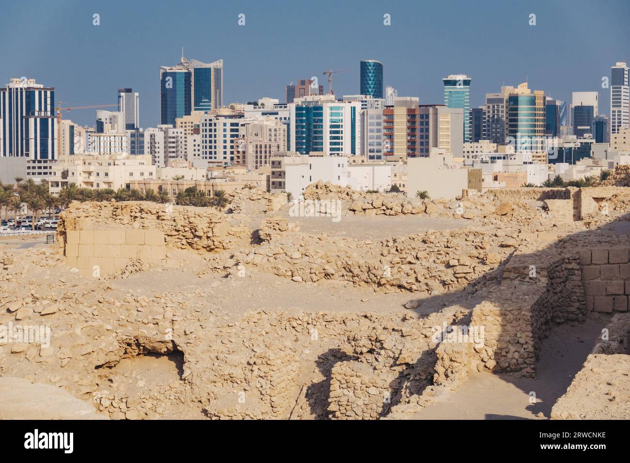 Old and new: the stone wall ruins of Bahrain Fort, dating back to 2300 ...