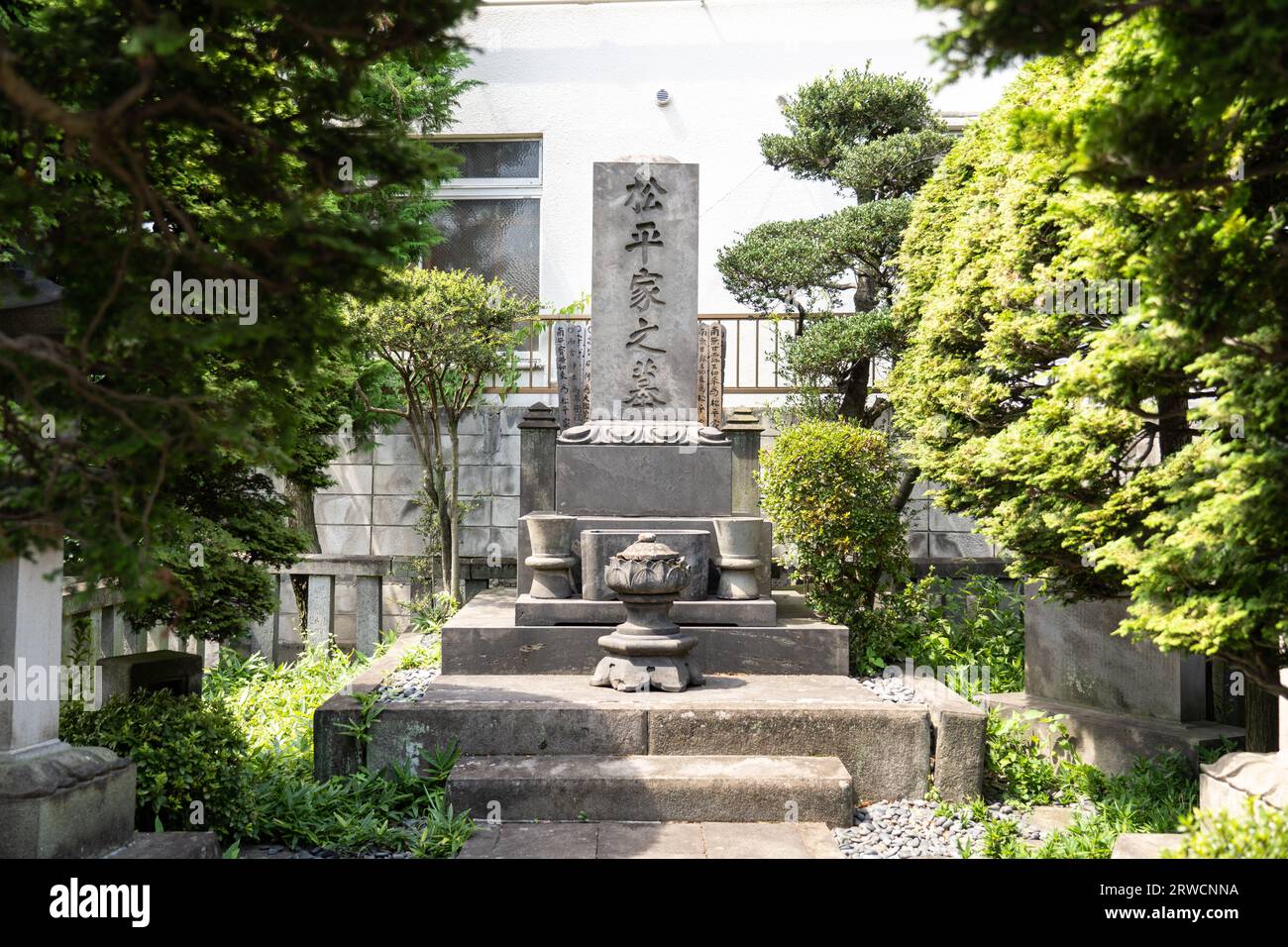 Traditional Buddhist style tomb marker at small cemetery attached to ...