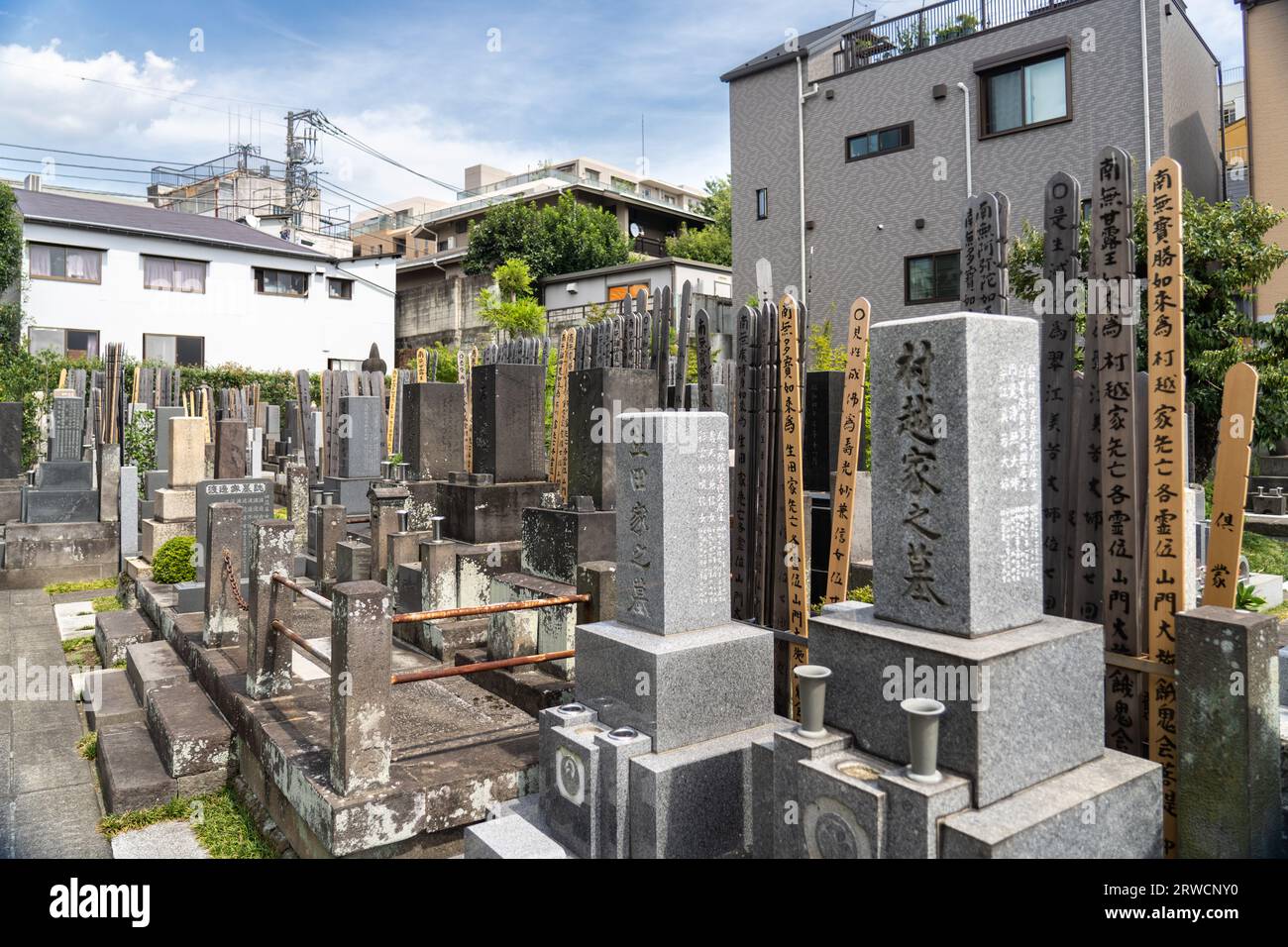 Traditional Buddhist style tomb marker surrounded by wooden planks ...