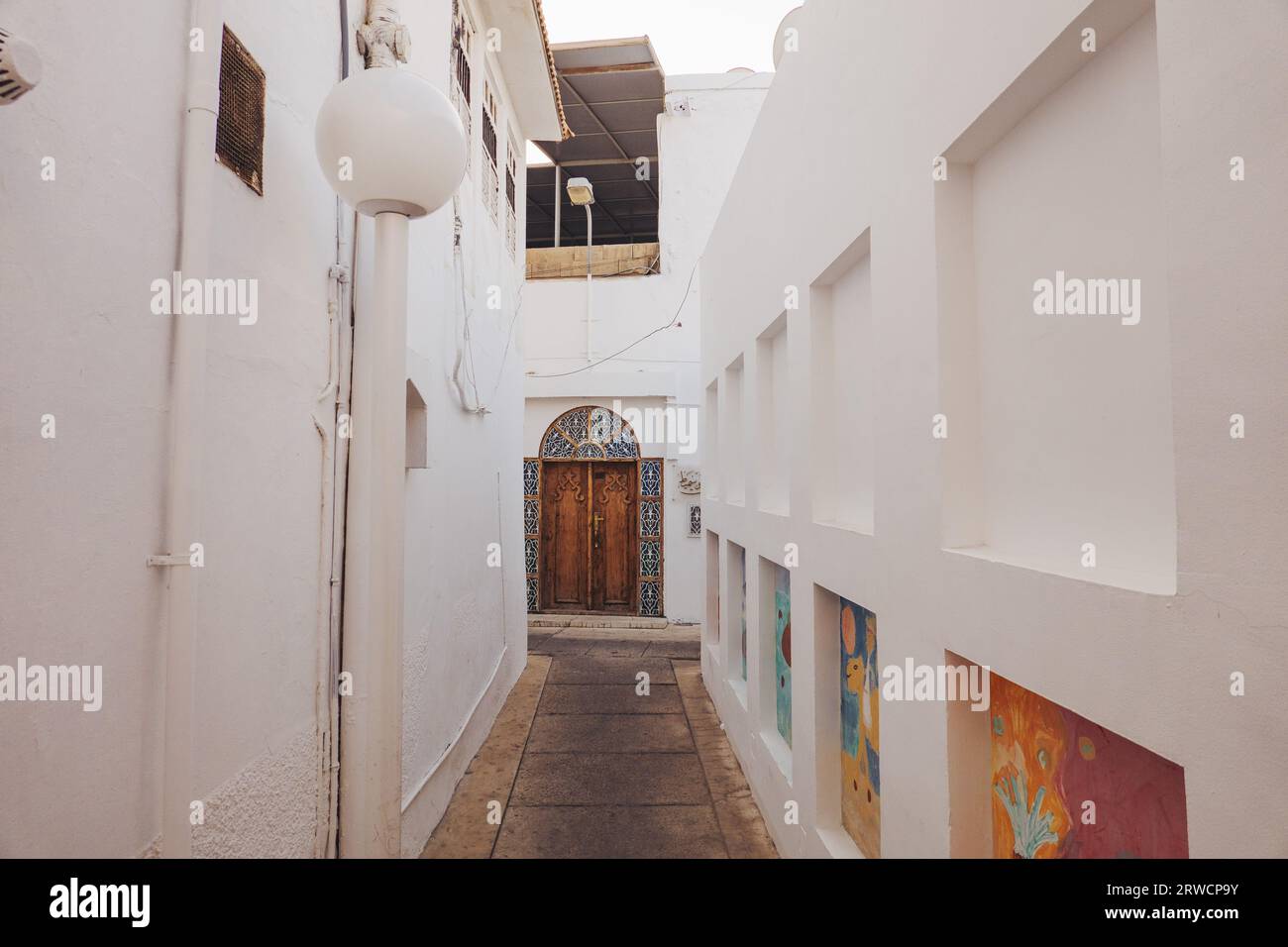 The hallmark narrow streets and white buildings of Muharraq, an ...