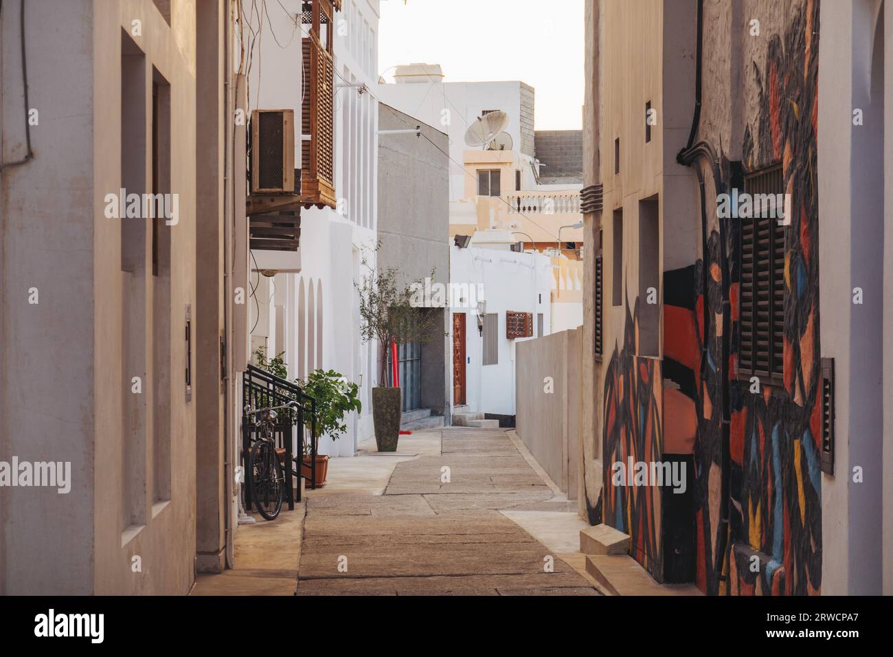 The hallmark narrow streets and white buildings of Muharraq, an ...