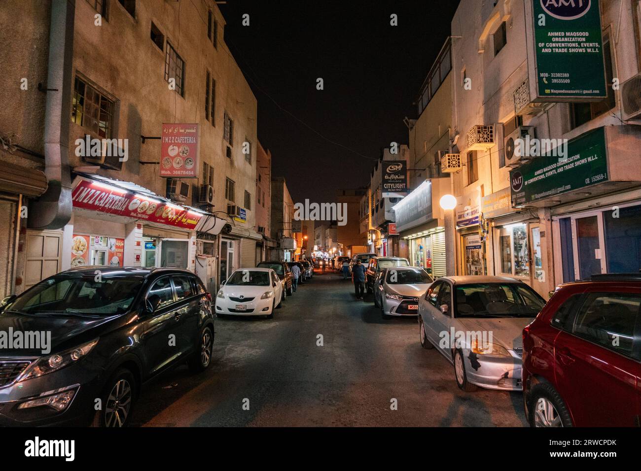 a quiet street at night in Manama, Bahrain, on the Pearling Path, a ...