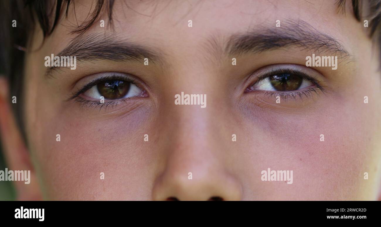Young boy opening eyes looking to camera. Child eye staring to viewer ...