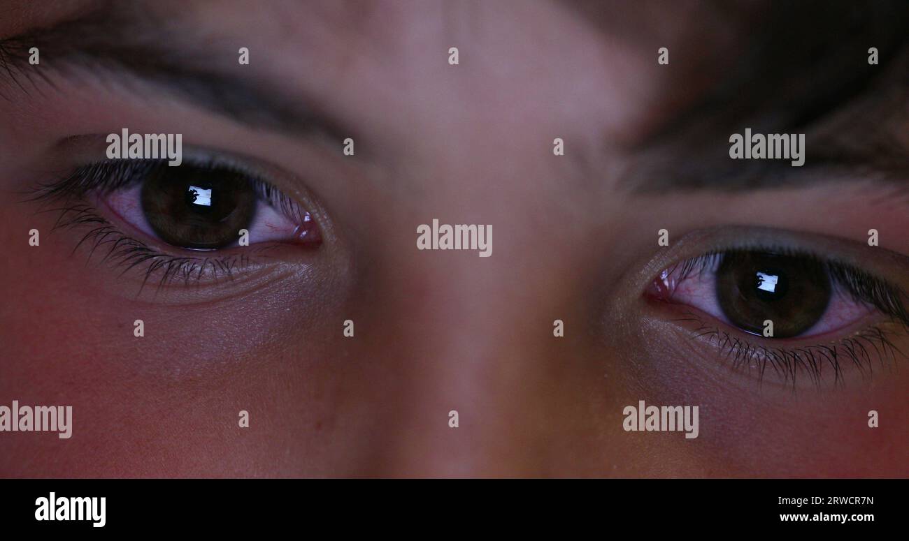 Young boy eyes macro close-up of eyes. Child eye staring at scren ...