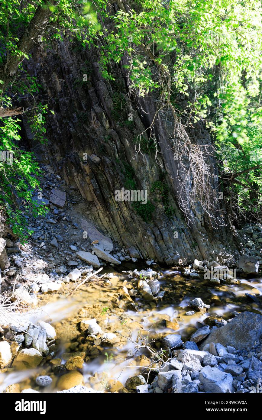 striped rock formation by stream, rock canyon, utah Stock Photo - Alamy
