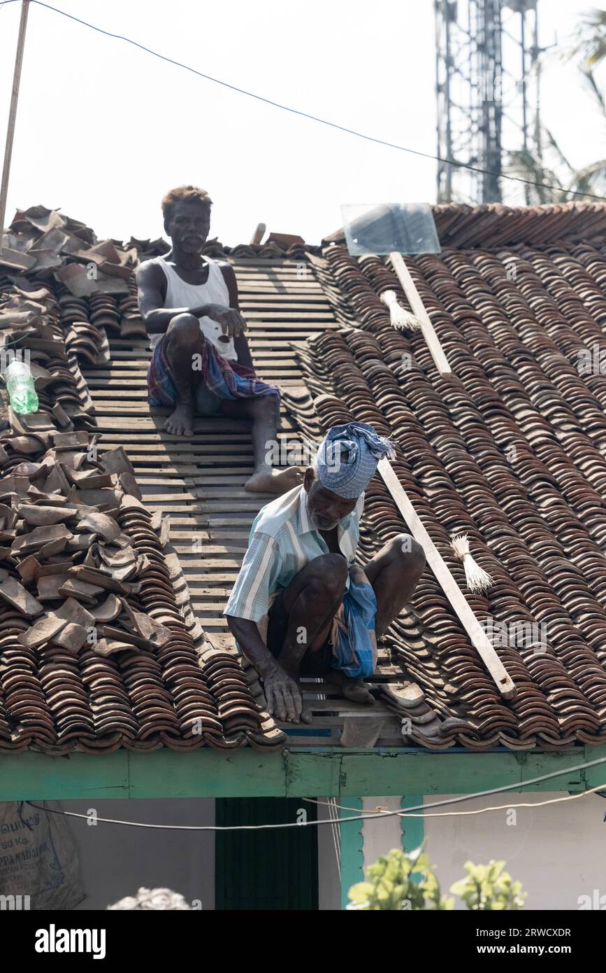 February 14, 2023, Chennai city, India: Two local men are roofing the house Stock Photo - Alamy