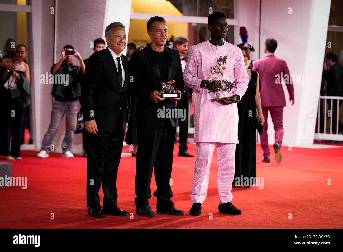 Venice, Italy. 18th Sep, 2023. Seydou Sarr and Matteo Garrone pose with ...