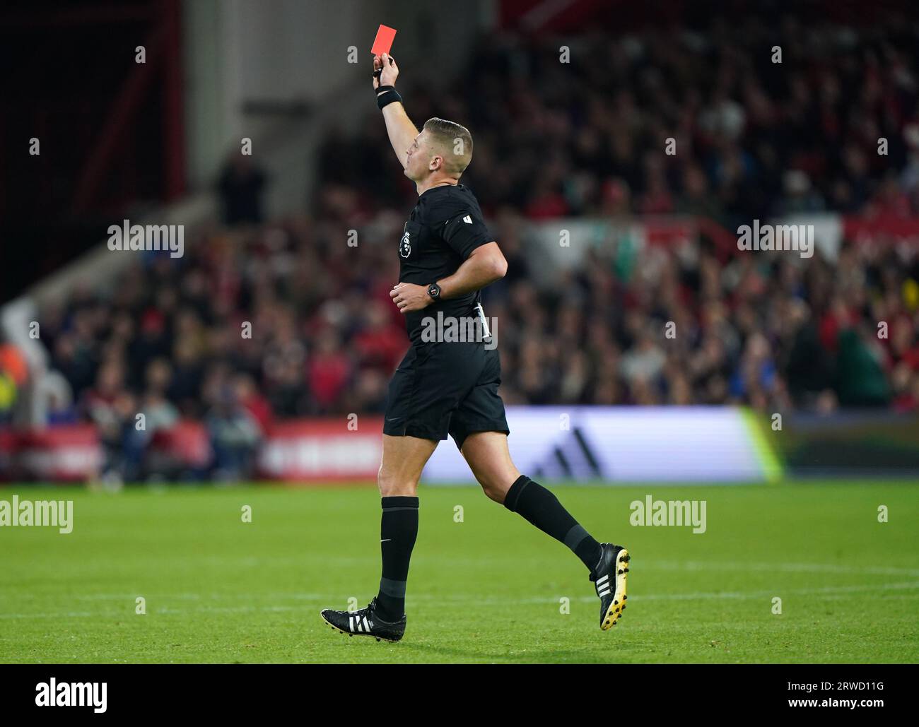 Referee Robert Jones shows a red card to Burnley's Lyle Foster (not ...