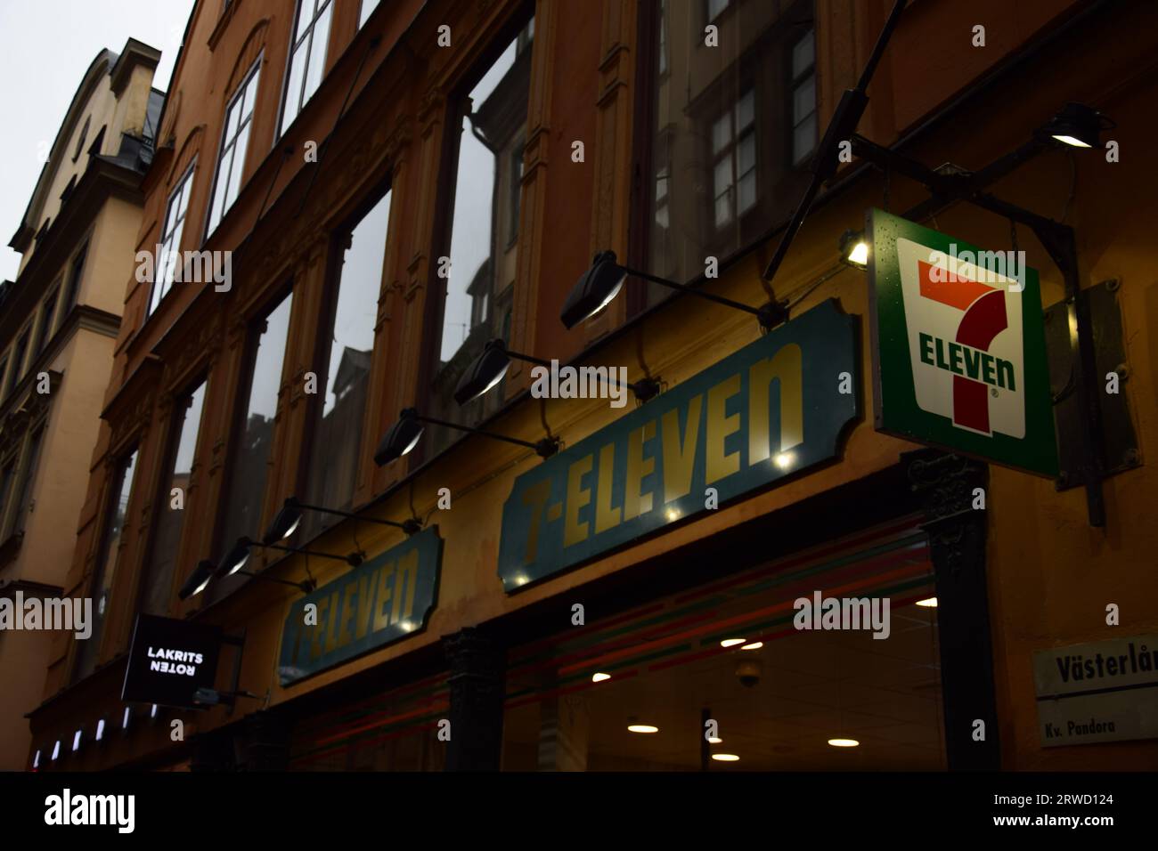 Old 7-eleven signs on a building facade Stock Photo - Alamy