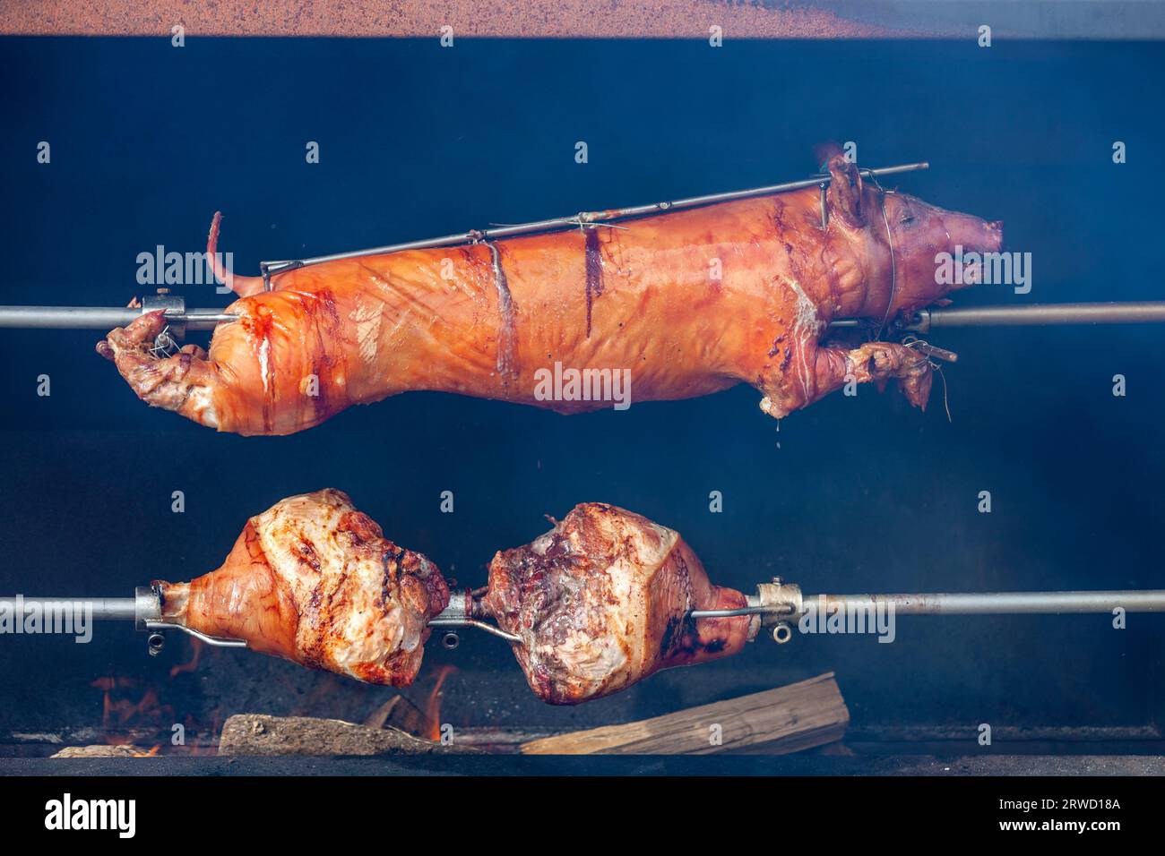 Spit Roasted pig on the traditional barbecue Stock Photo - Alamy