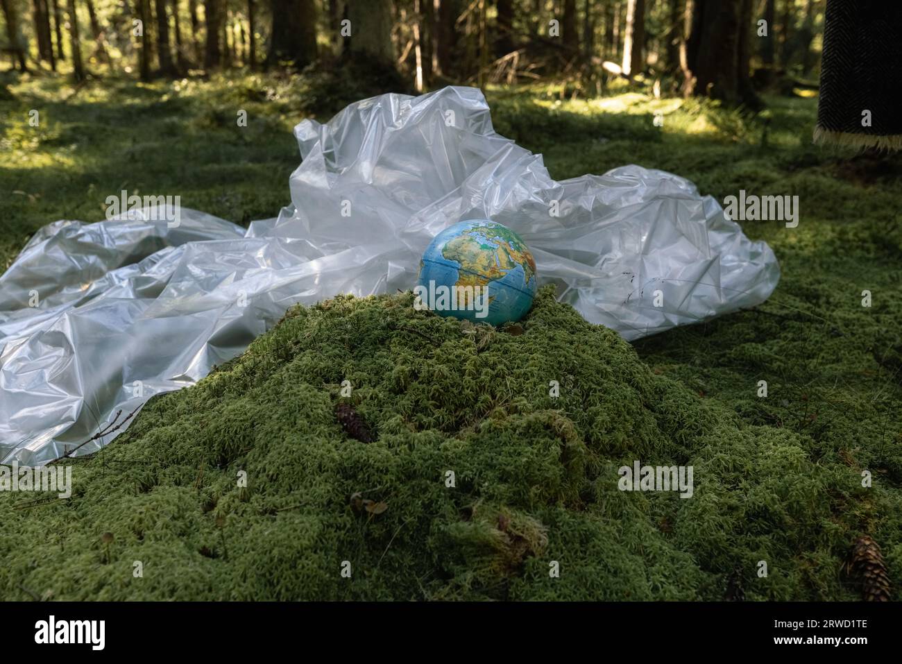 globe and plastic film green forest, Pollution of the environment. The ...