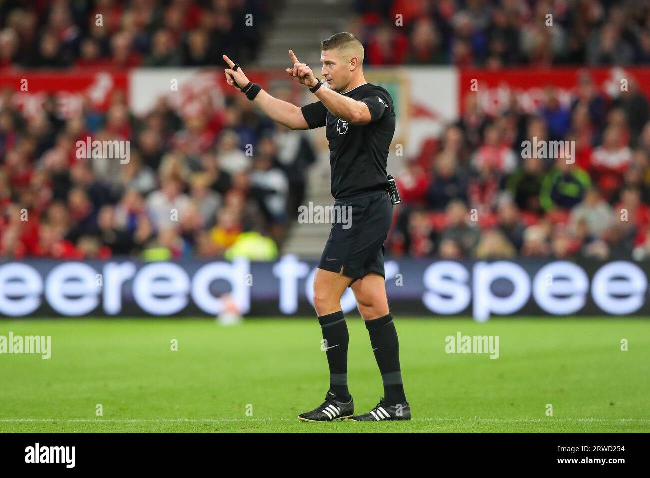 Referee Robert Jones signals the checking the VAR monitor during the ...