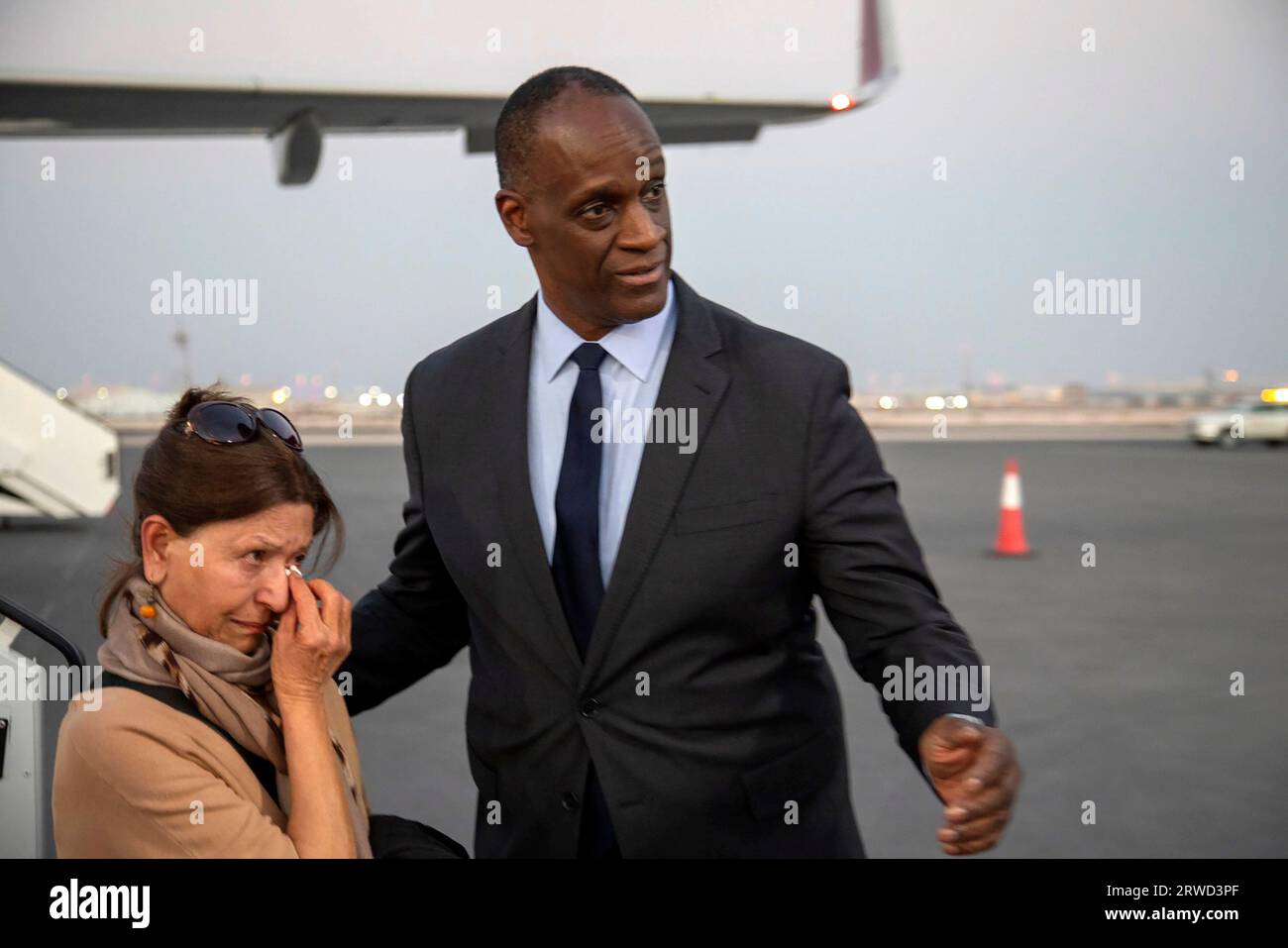 US Ambassador to Doha Timmy Davis (R) welcomes five citizens of United ...