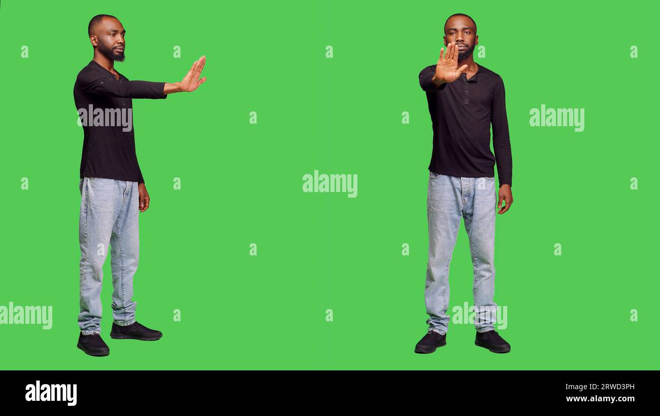 Negative person raising hand doing stop sign on camera, expressing ...