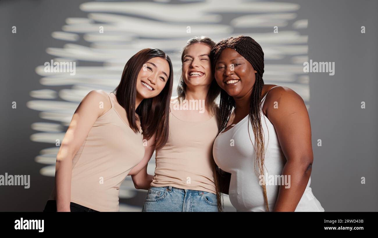 Group of diverse girls feeling positive about body types, laughing and ...