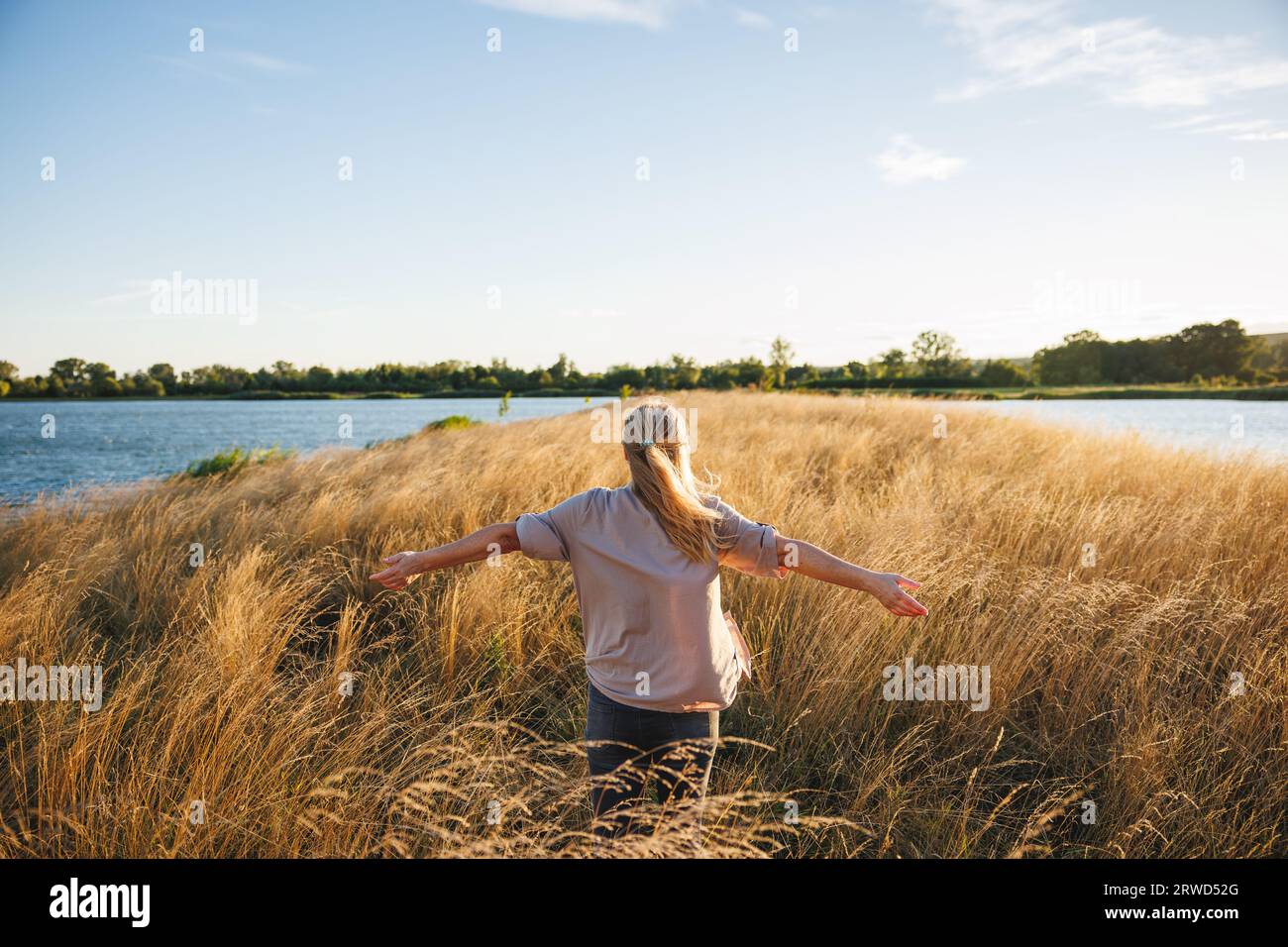 Woman enjoying the weather beach hi-res stock photography and images ...